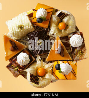 Assorted different mini cakes with cream, chocolate and berries Stock ...
