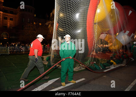 Workers inflate helium balloons for the Macy's Thanksgiving Day Parade ...