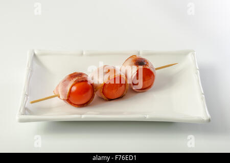 Bacon wrapped Cherry Tomatoes on stick Stock Photo - Alamy