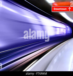super streamlined train with motion blur moves from city Stock Photo ...