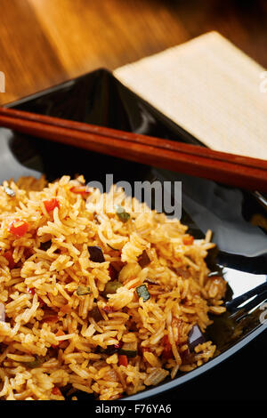 Basmati rice with vegetables on black square dish Stock Photo - Alamy