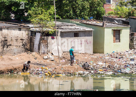 Third world poverty lifestyle: Local people sifting rubbish in slums on ...