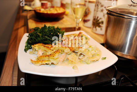 Home made fish pie with a flaky puff pastry lattice topping ready to ...