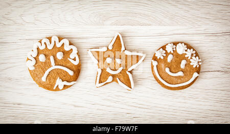 Gingerbread unhappy face on the wooden background. Christmas symbol ...
