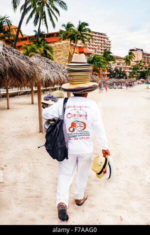 Man is selling hats on a beach on Boracay island. Lots of hats on his ...
