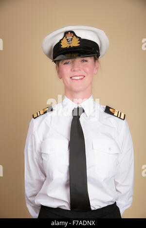 Female navy officer in uniform of a Lt Commander wearing a hat and ...