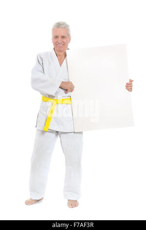 Karate Senior man with poster Stock Photo - Alamy
