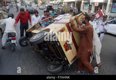 An overloaded auto rickshaw strayed off due to over speeding near ...