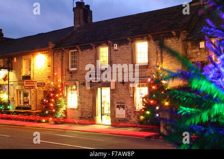 Decorated Christmas trees light up the main street in Castleton; a ...