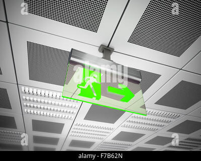 Exit sign hanging on suspended ceiling Stock Photo - Alamy