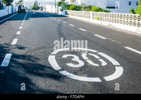 30 mph road markings for speed limit at the entrance to a town Stock ...