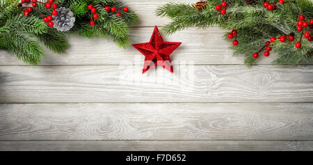 Christmas decoration with fir branches, mistletoe, wood cookies and ...