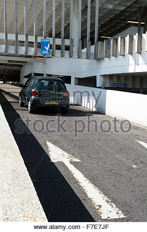 Entrance to car park ramp slope way on front of building Stock Photo ...