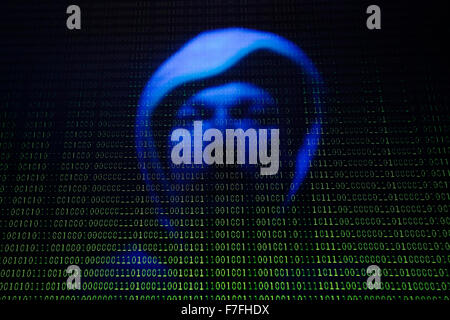 A face is reflected into a computer screen with binary type Stock Photo ...