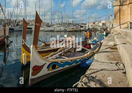 Traditional Maltese water taxi in the Grand Harbour in Valletta, Malta ...