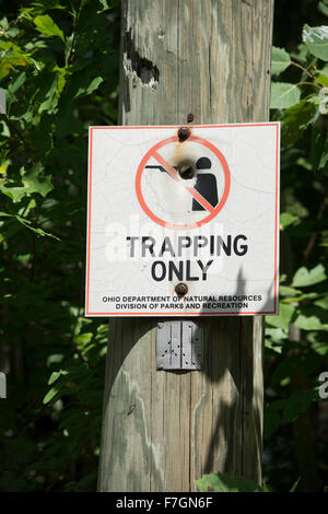 Trapping only sign Stock Photo - Alamy