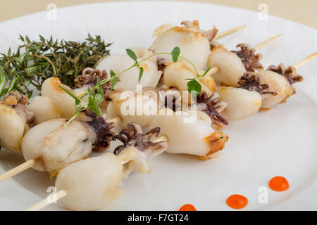 Grilled cuttlefish bbq with rosemary and pepper Stock Photo - Alamy