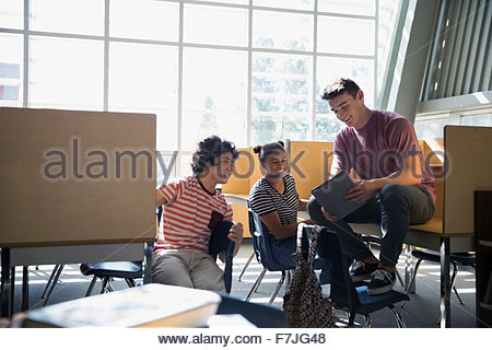 High school students using digital tablet in classroom Stock Photo - Alamy