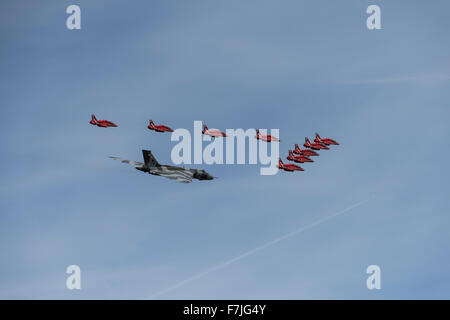 Avro Vulcan bomber and Red Arrows RAF BAe Hawk aircraft in formation at RIAT 2015, Fairford, UK ...