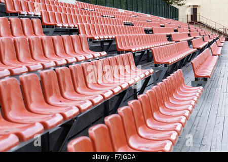 Stadium curve, brown seat on stadium steps bleacher Stock Photo - Alamy