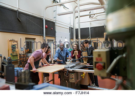 High School Wood shop with students creating projects Stock Photo - Alamy