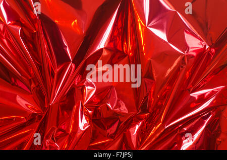 red shiny metallic foil background Stock Photo - Alamy