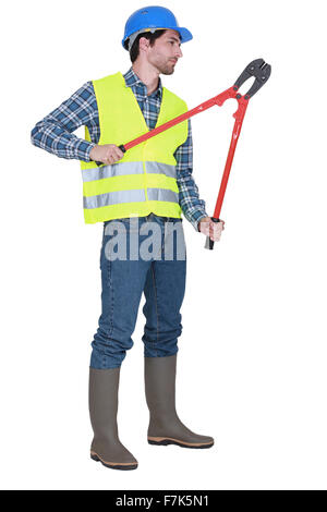 Man holding bolt cutters Stock Photo - Alamy