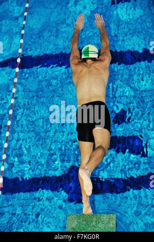 start position race concept with fit swimmer on swimming pool Stock ...