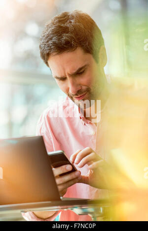 Perplexed man at computer Stock Photo - Alamy