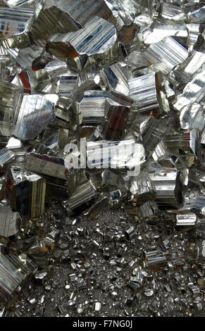 Pyrite. The mineral's metallic luster and pale brass-yellow hue give it ...