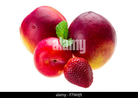 Ripe bright peaches, plum and mint Stock Photo - Alamy