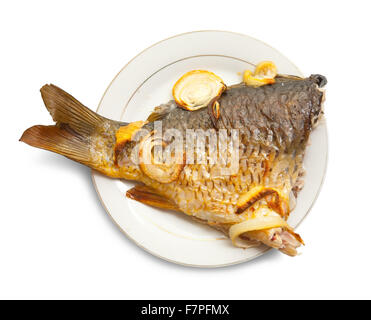 Carp fish on white plate with limeta and onion Stock Photo - Alamy