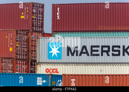 Maersk shipping containers with company logo signage. White ...