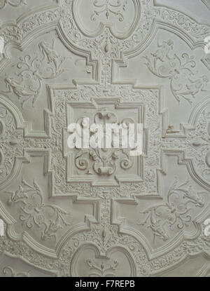 Ornate decorative plasterwork ceiling in historic dilapidated building ...
