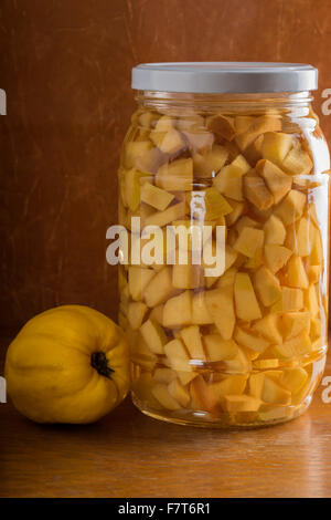 Quince compote in glass bowl on wooden table Stock Photo - Alamy