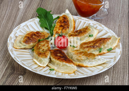 Japanese cousine - Gyoza served green onion and cherry tomato Stock ...