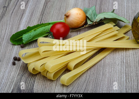 Italian raw Pata Fettuccine on the wood background Stock Photo - Alamy