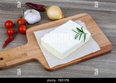 Traditional Caucasian homemade Cheese Brinza with rosemary on wood ...