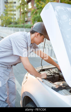 Side street mechanic working with engine parts in the Philippines Stock ...