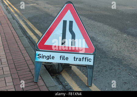 A single file traffic sign warning of a contra flow in roadworks in ...