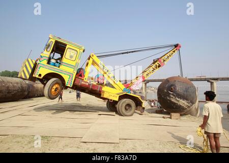A crane carry a capsool to construct temporary pontoon bridge in the ...