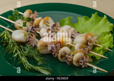 Grilled cuttlefish bbq with rosemary and pepper Stock Photo - Alamy