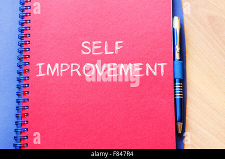 Self improvement text concept write on notebook with pen Stock Photo ...