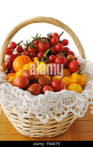 Tomatoes on the table. Tomatoes of different varieties Stock Photo - Alamy