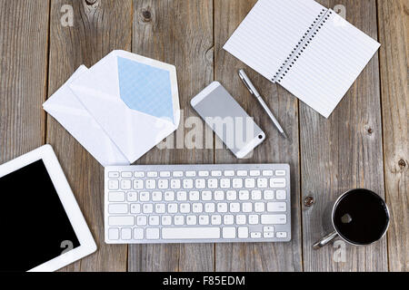 Angled View of laptop Computer Keyboard and glasses with Various Office ...