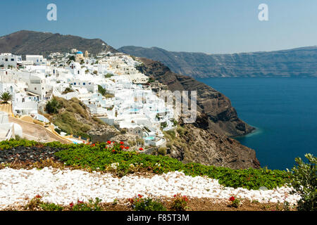 Santorini. Clifftop view along rim of caldera with part of Oia town ...