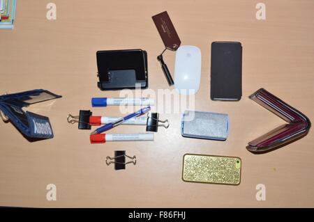 A messy study table of student with electronic devices and study stuffs ...