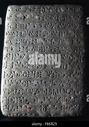 A stone tablet with a cuneiform inscription. It is an example of the so ...