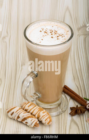 Cappuccino with pastry, cinnamon and flower Stock Photo - Alamy