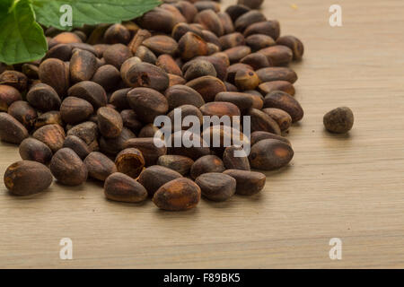 Cedar nuts on the desk Stock Photo - Alamy